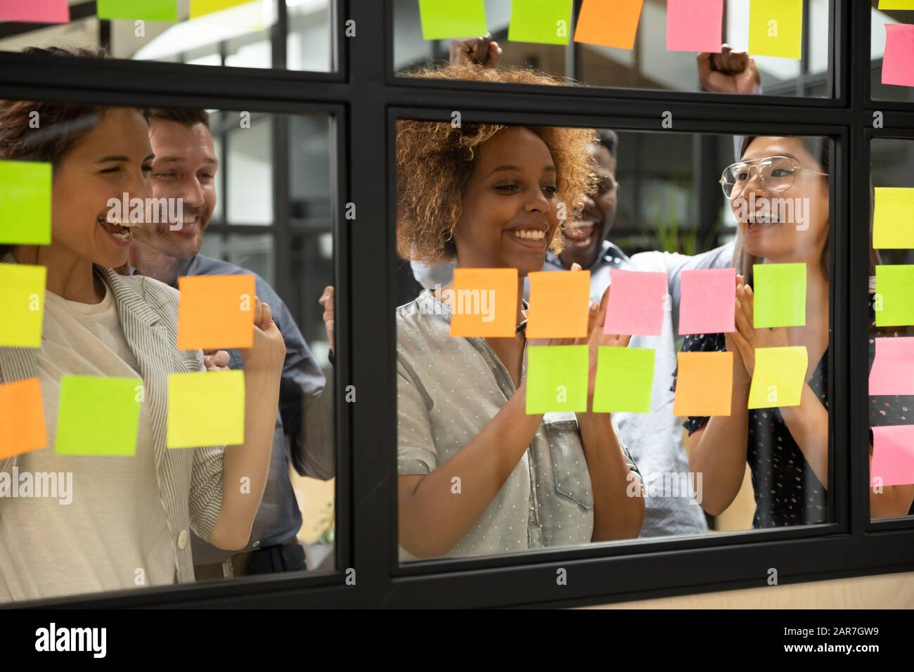 Excited multiethnic team celebrate successful project complete Stock ...