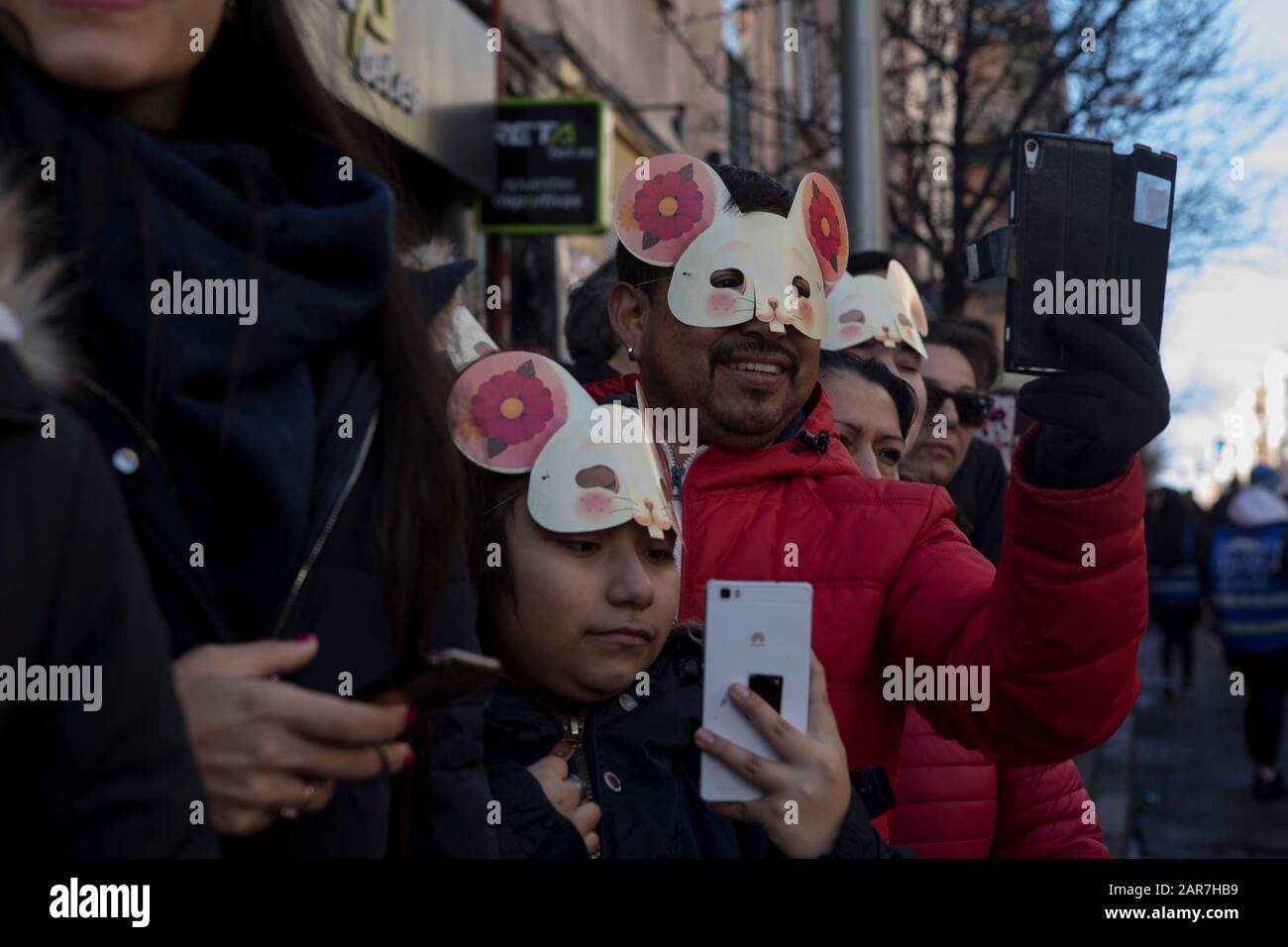 People with rat masks taking selfies during the parade.More than 1,000 ...
