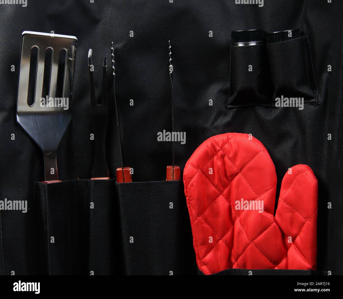 BBQ instruments kit close up isolated on black background Stock Photo ...