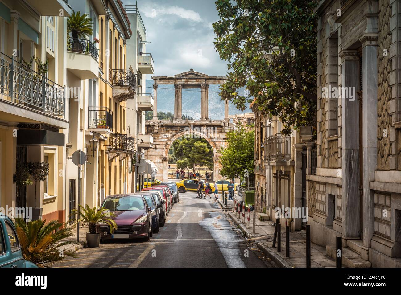 Old street in Athens overlooking the ancient Arch of Hadrian or Hadrian ...