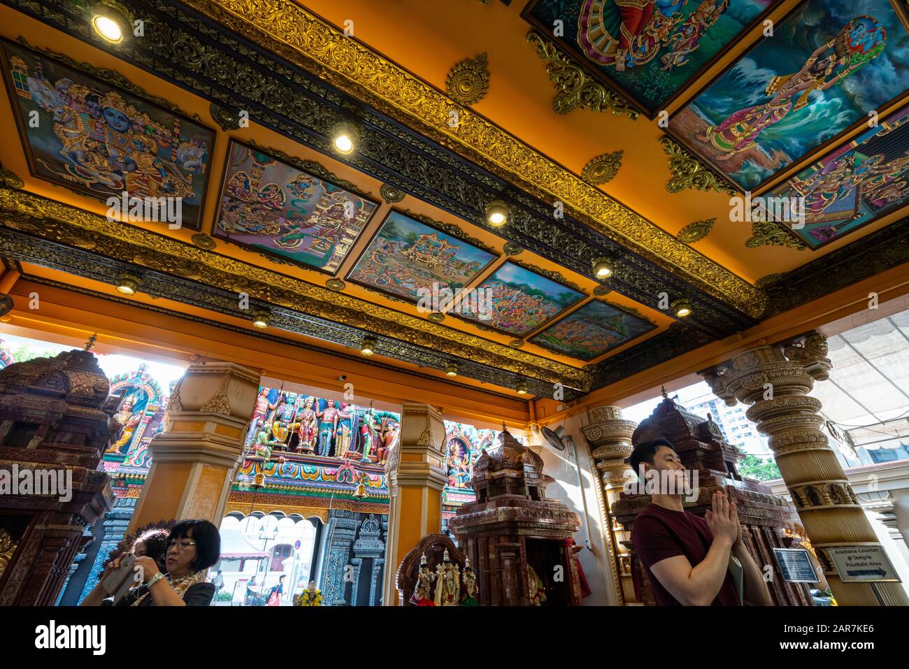 Singapore. January 2020. the faithful praying inside the Sri Krishanan ...