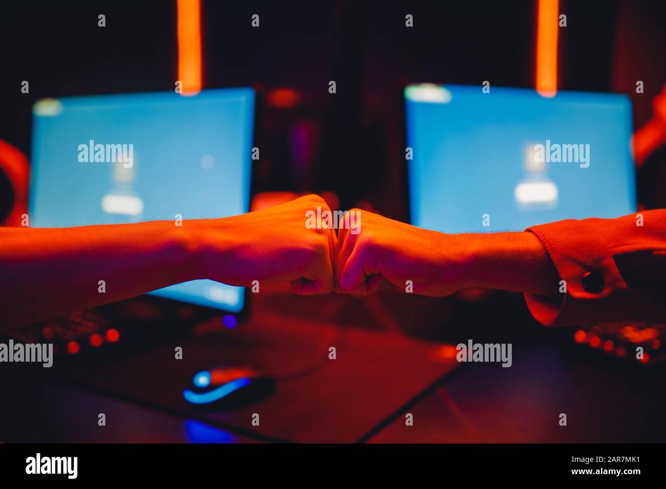 Professional gamer greeting and support team fists hands online game in ...