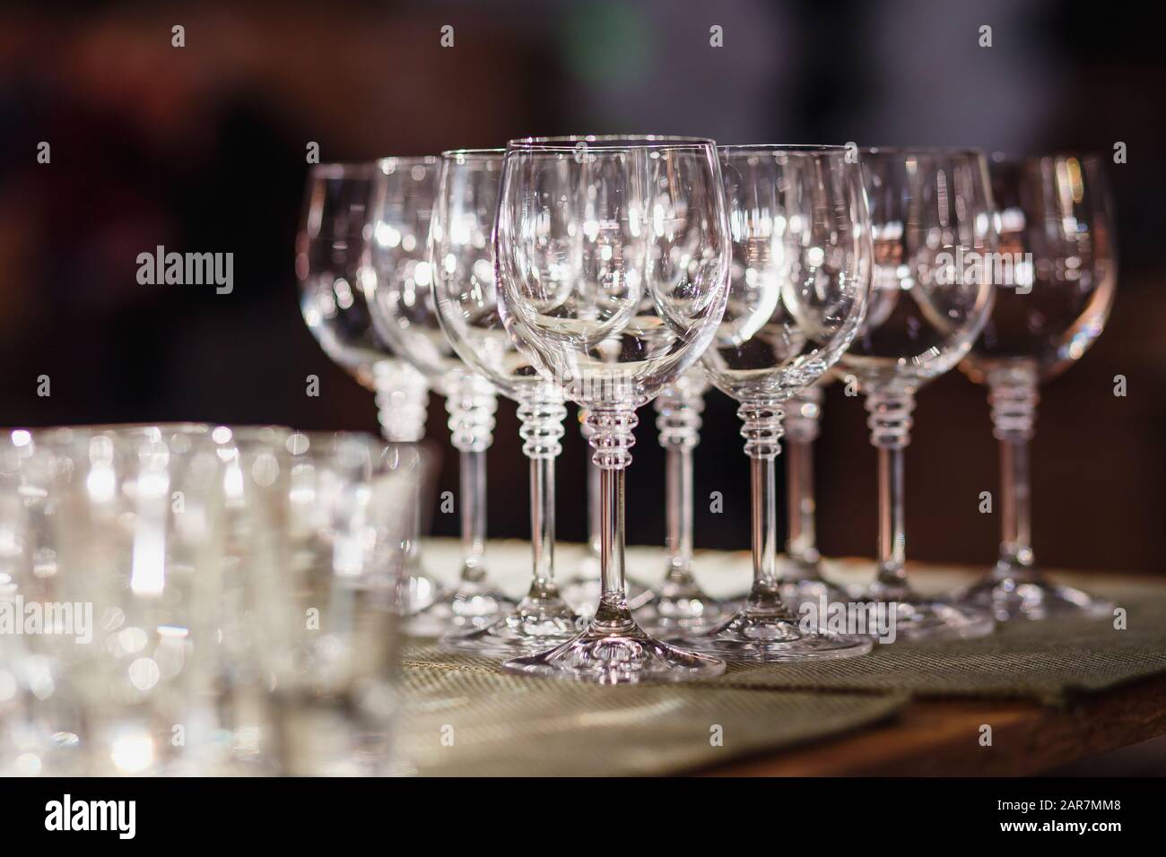 Catering service. Table setting, glass goblets, cutlery Stock Photo - Alamy
