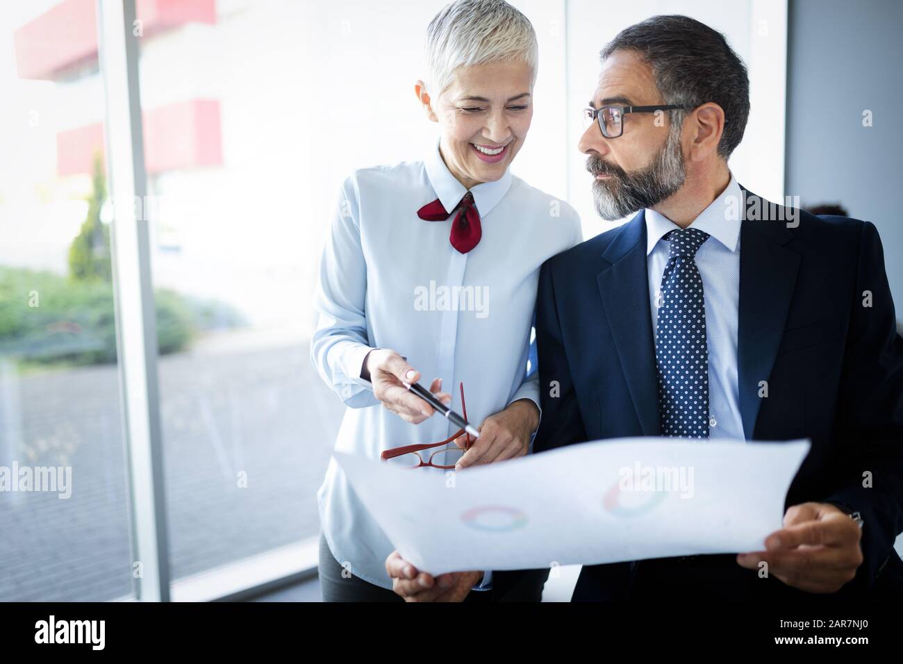 Portrait of architects having discussion in office Stock Photo - Alamy