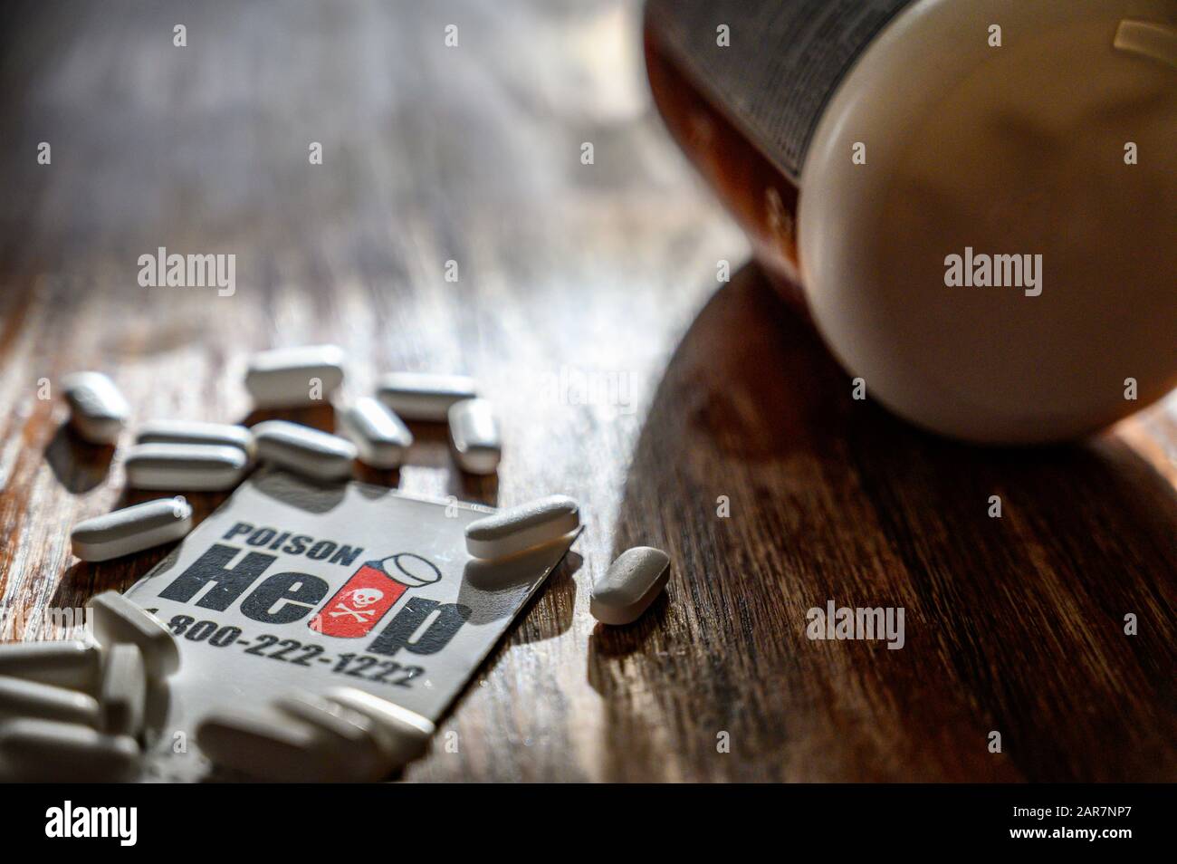 Poison control hotline number with assorted medical pills Stock Photo ...