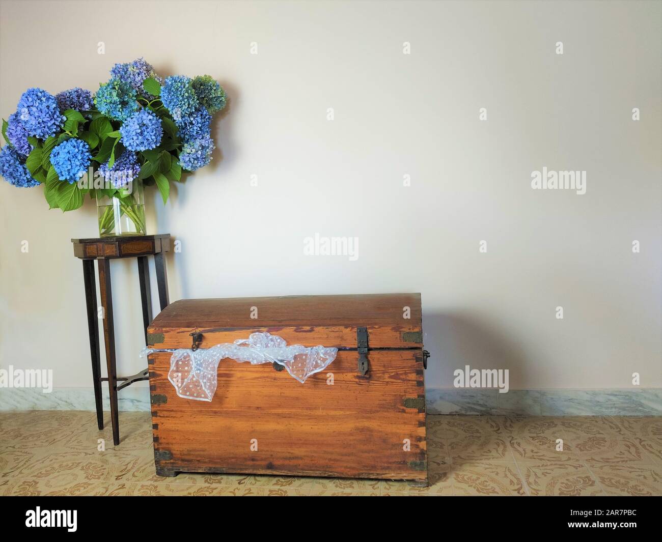 old wooden vintage chest, vase with blue hydrangea flowers Stock Photo ...