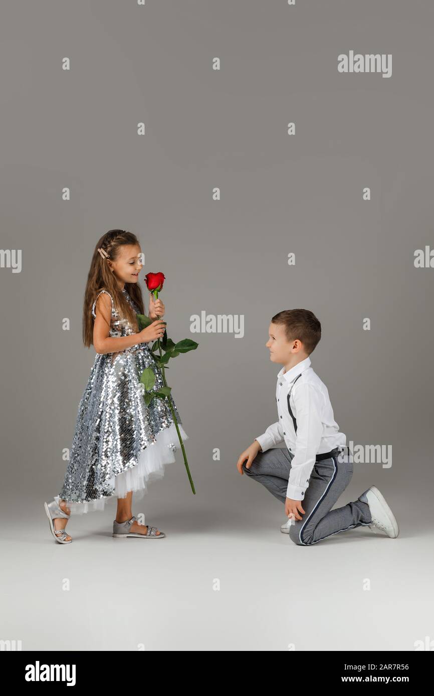 Boy giving flower girl hi-res stock photography and images - Alamy