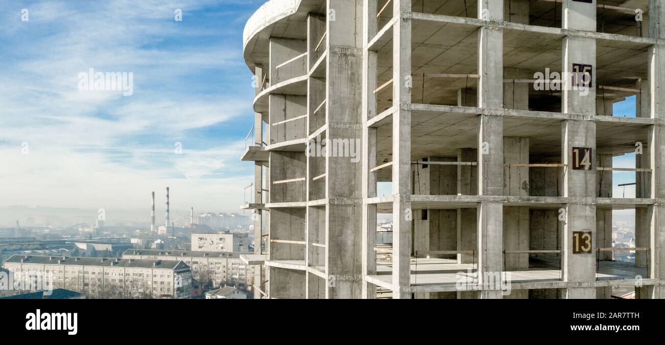 Panorama of Aerial view of concrete frame of tall apartment building ...