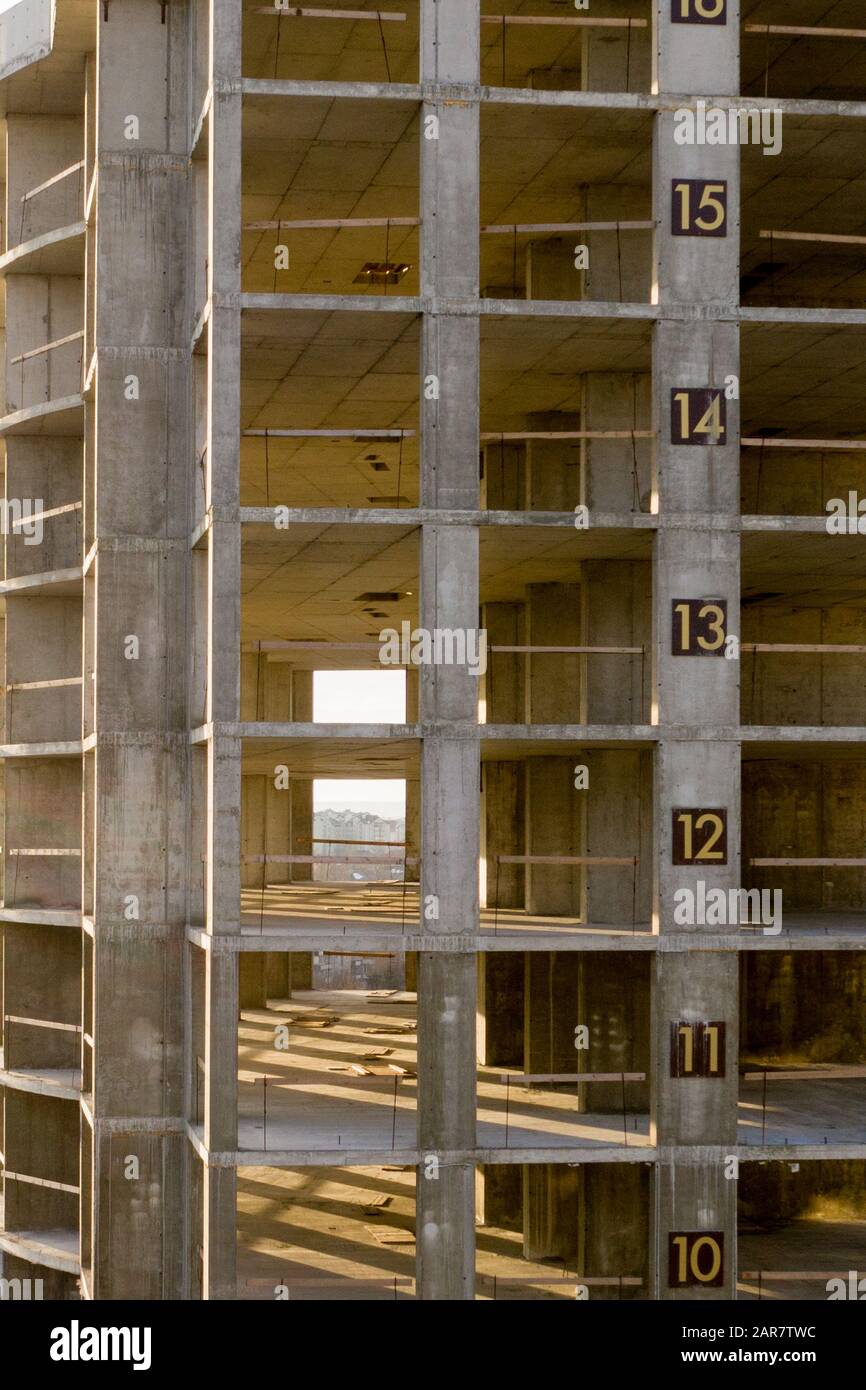 Aerial view of concrete frame of tall apartment building under ...