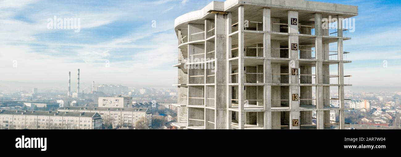Panorama of Aerial view of concrete frame of tall apartment building ...