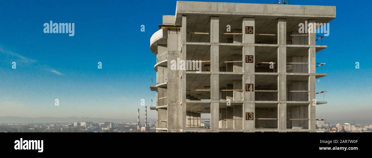 Panorama of Aerial view of concrete frame of tall apartment building ...
