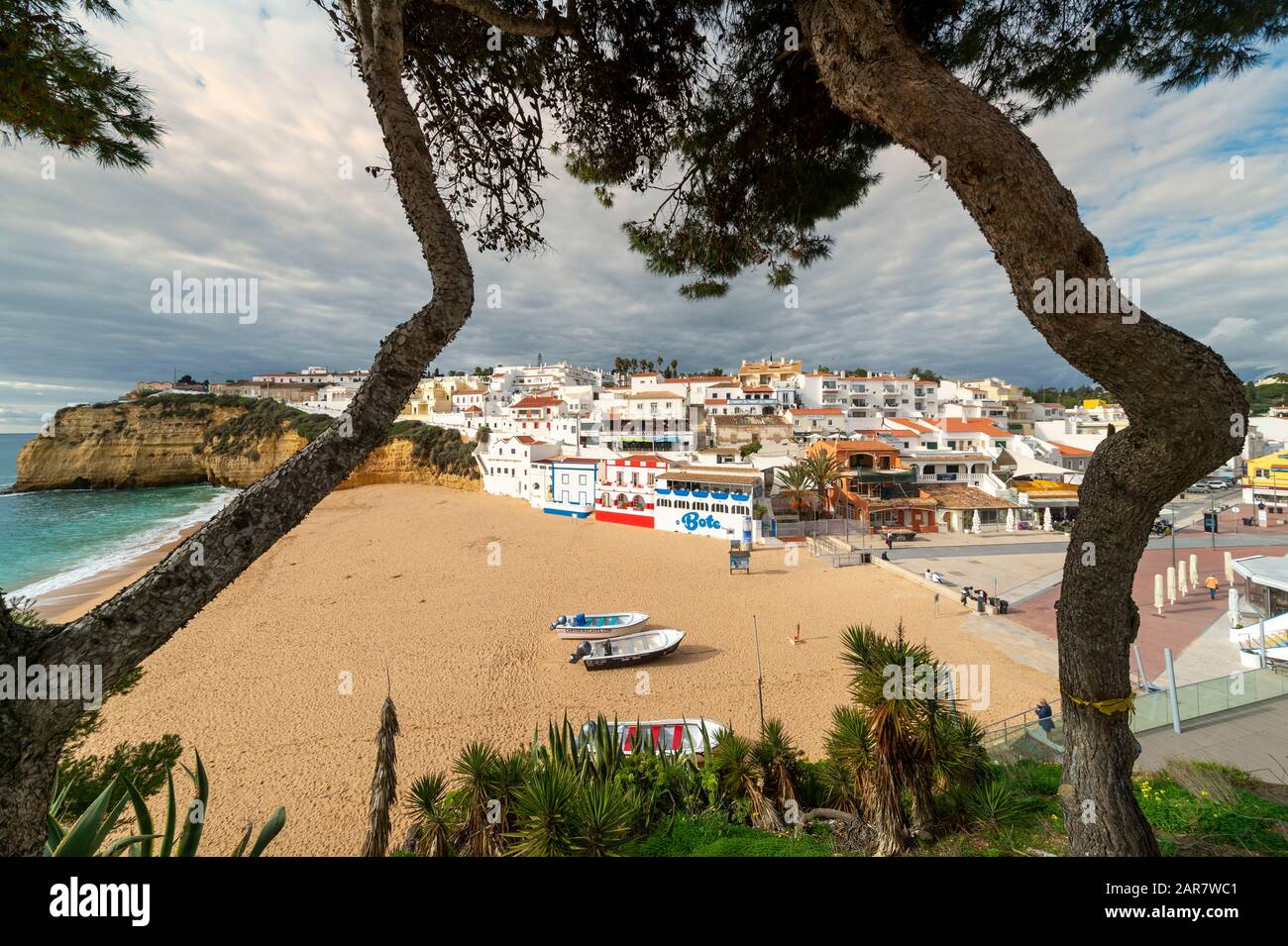 The beach and coastal town of Carvoeiro in the Algarve region of ...