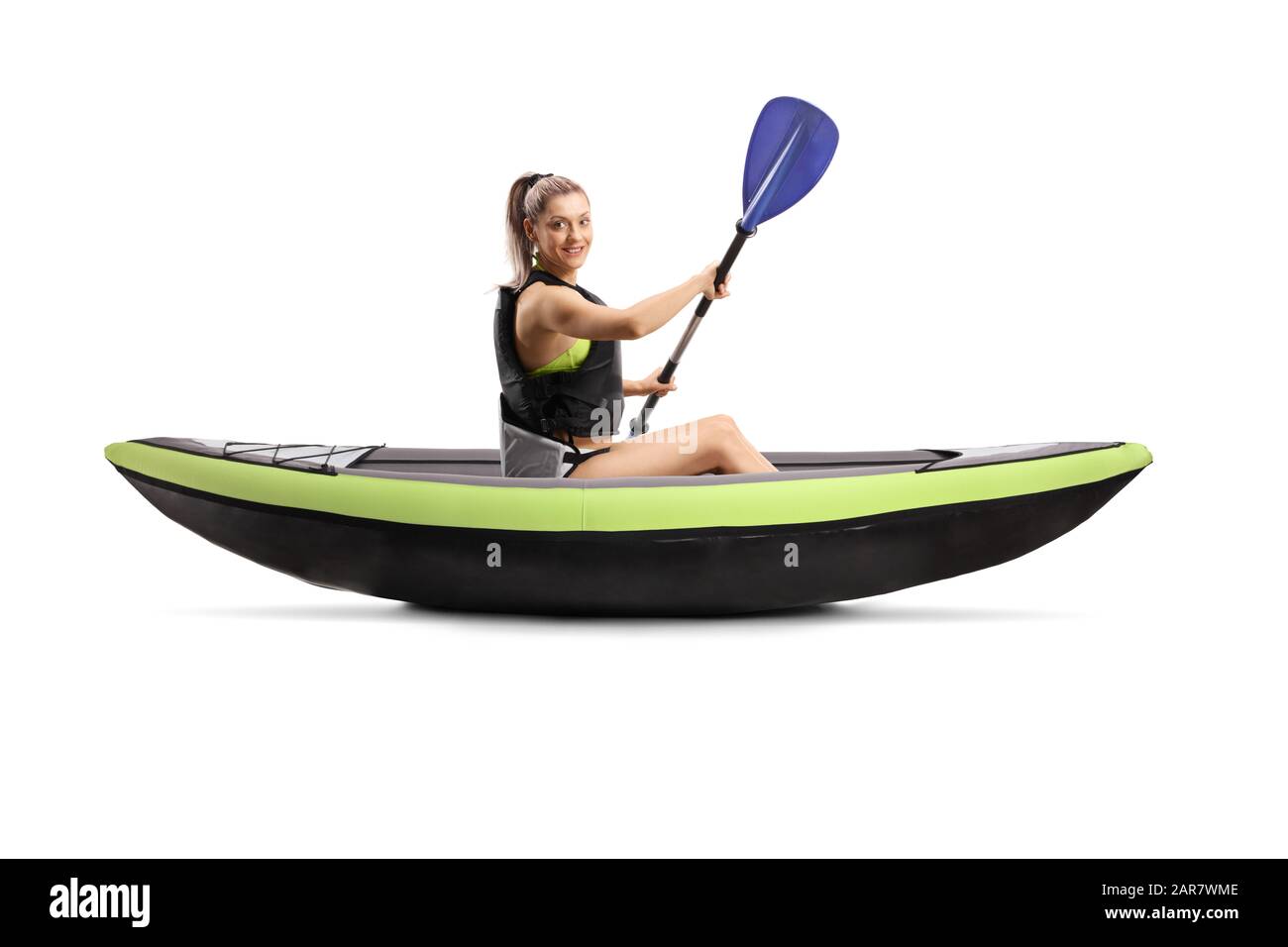 Woman paddling a canoe Cut Out Stock Images & Pictures - Alamy