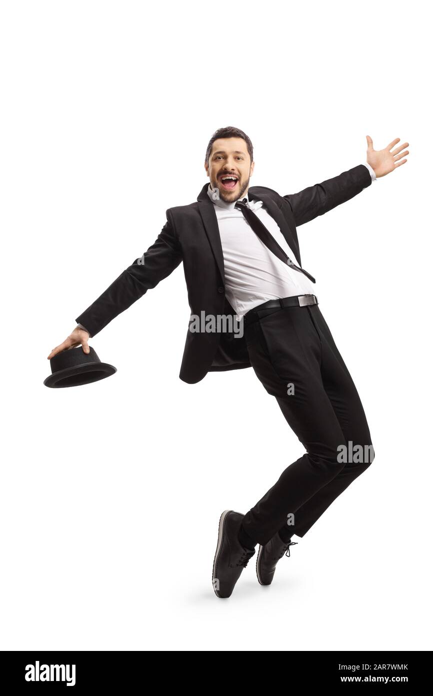 Full length shot of a guy in a suit dancing and singing isolated on ...