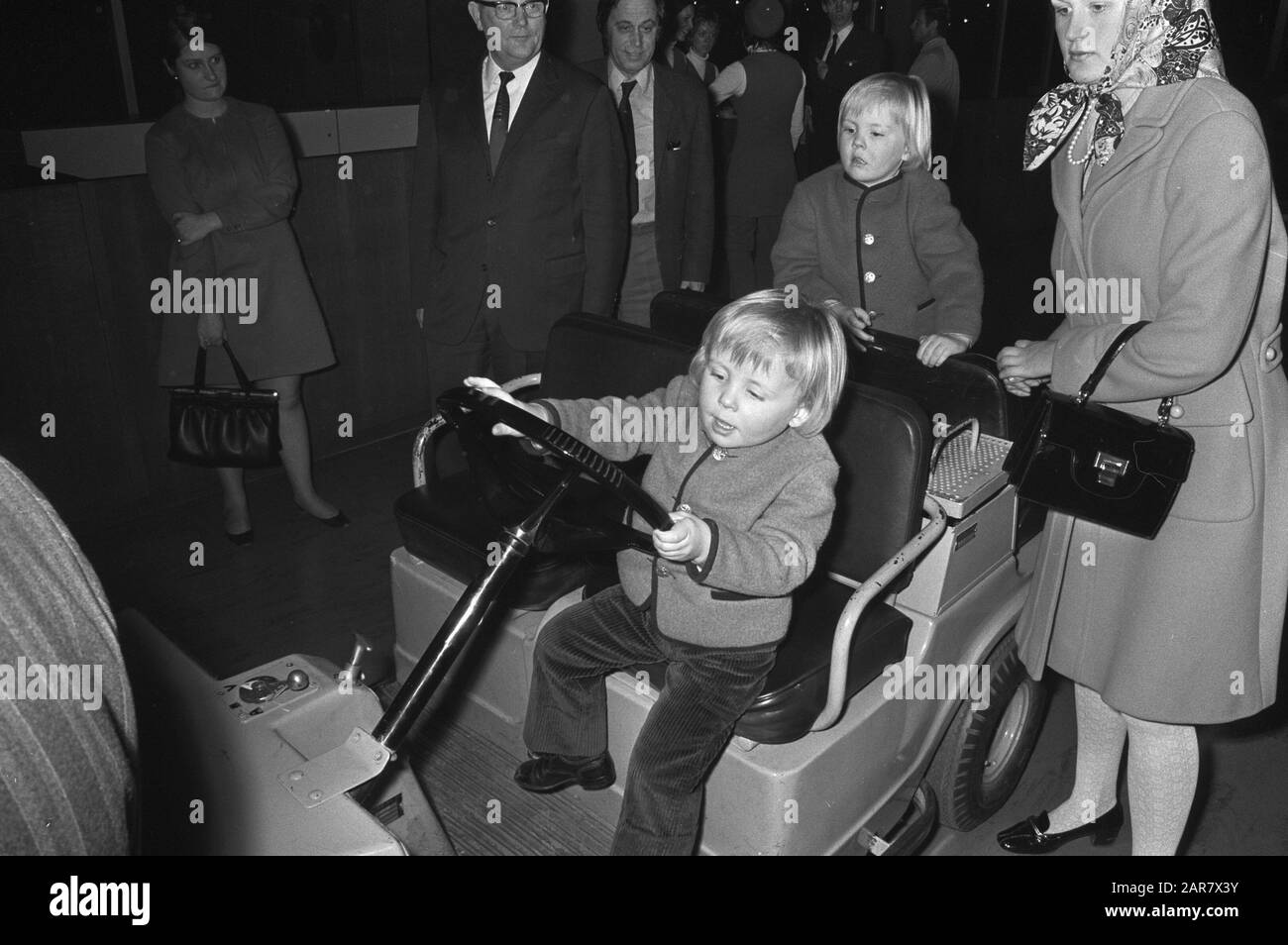 Prince Johan Friso at the wheel of cart behind him Prince Willem ...