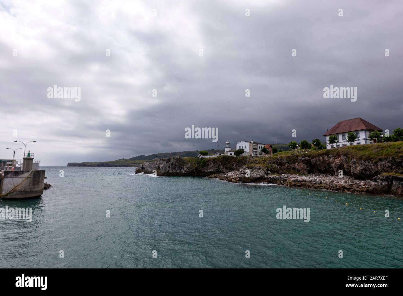 Port and lighthouse in Llanes, Asturias, Spain Stock Photo - Alamy