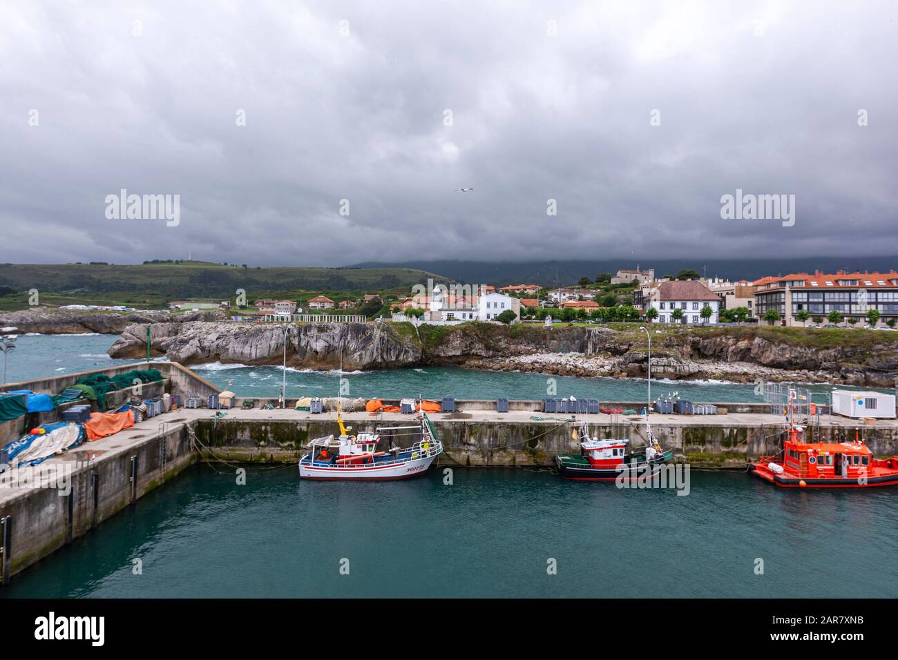 Port and lighthouse in Llanes, Asturias, Spain Stock Photo - Alamy