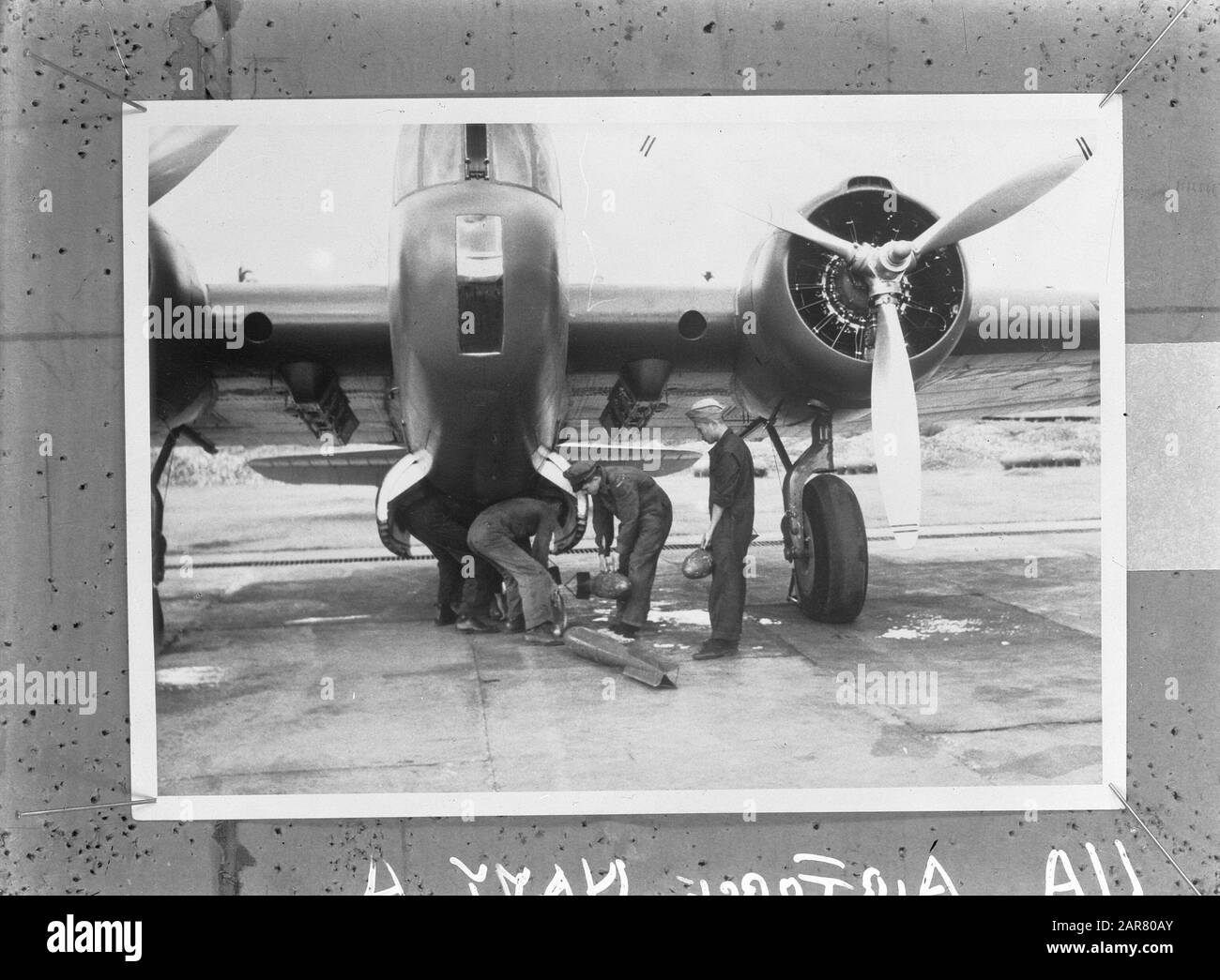 Ground personnel loads bombs into a Glenn Martin WH-3 bomber of the ...