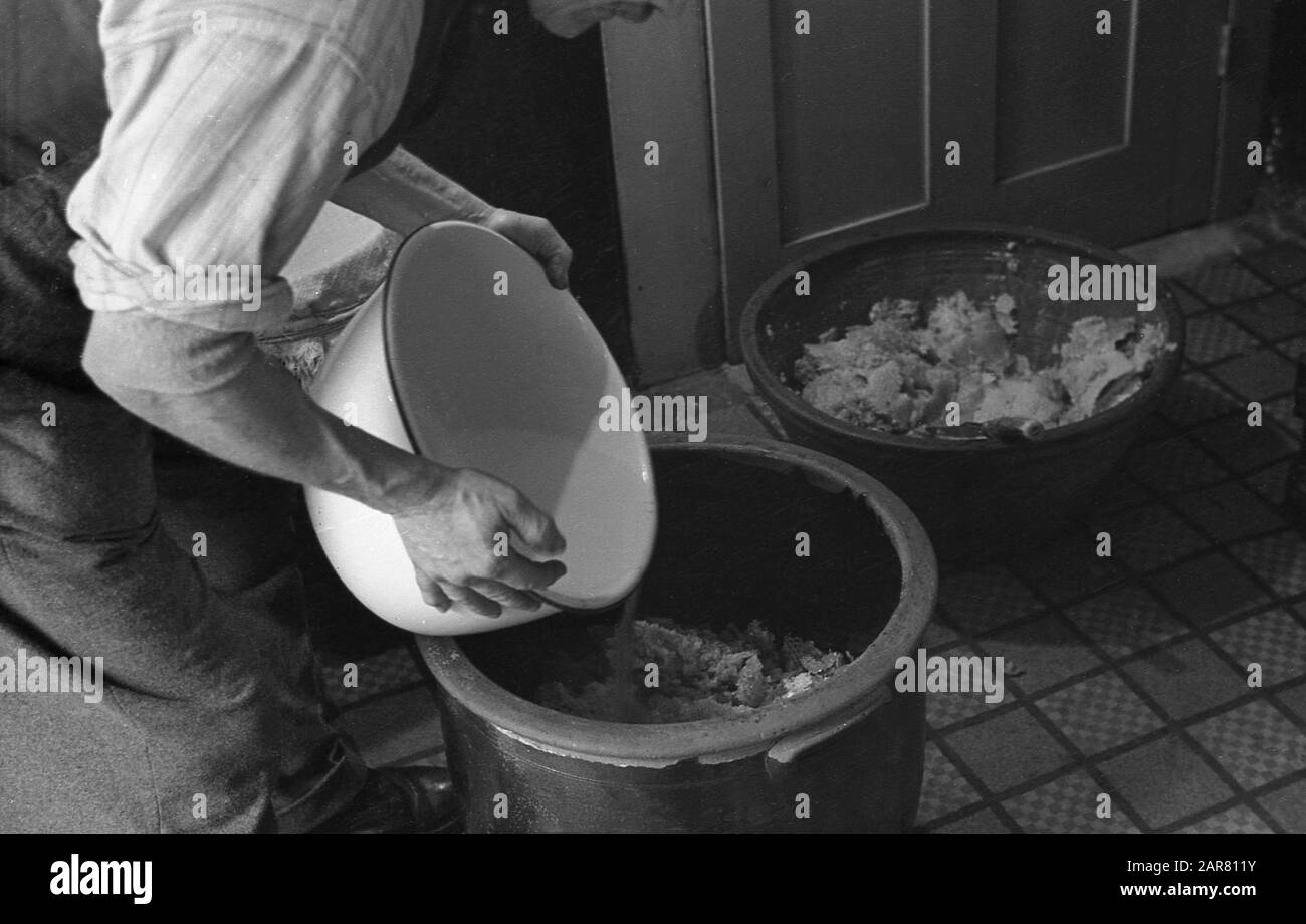 1950s, historical, making mead, a man pouring hot water into large ...