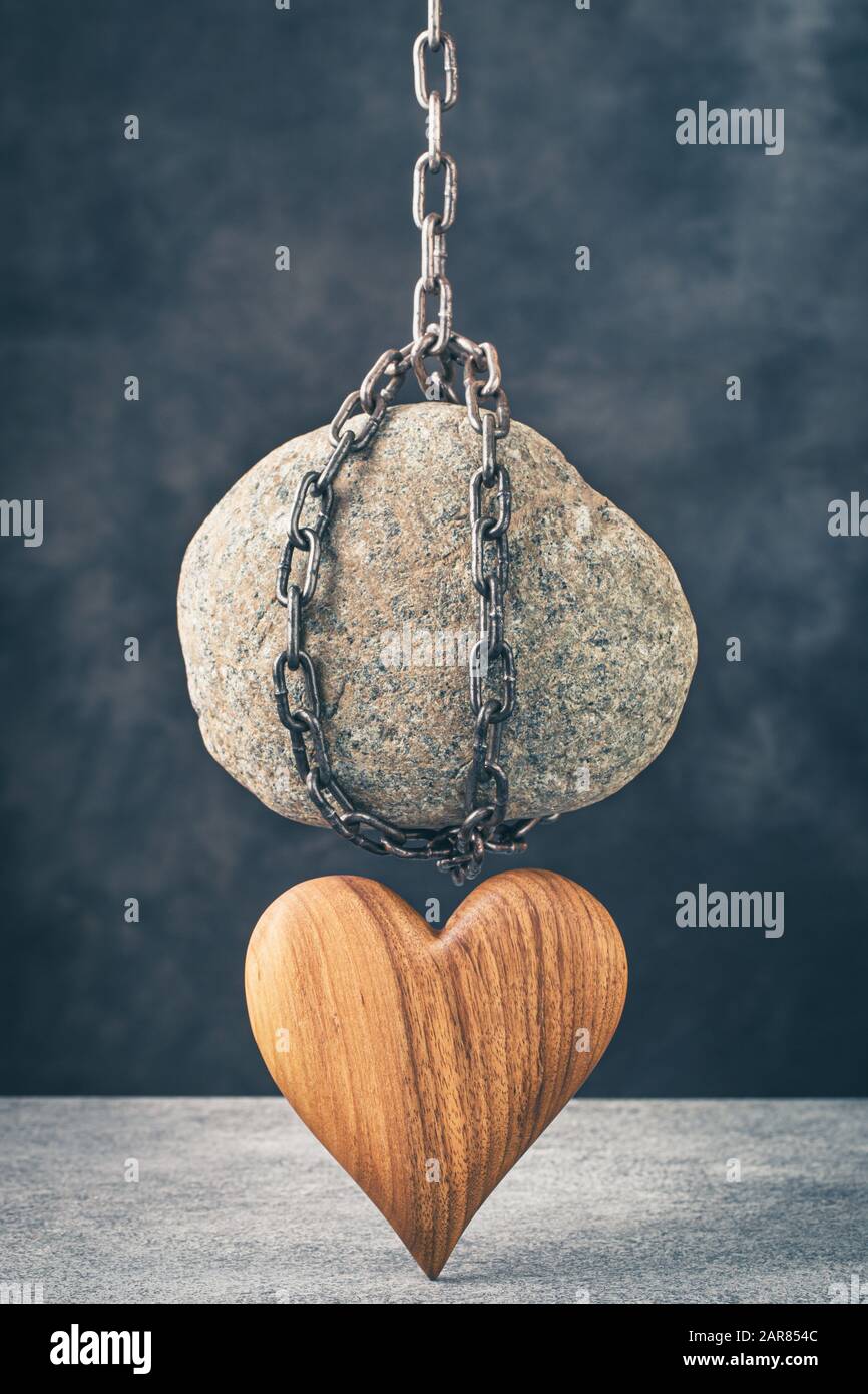 Stone over heart Stock Photo - Alamy