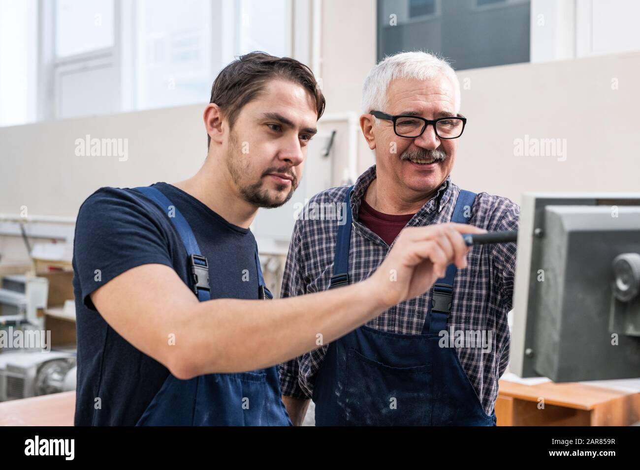 Production workers at plant Stock Photo - Alamy