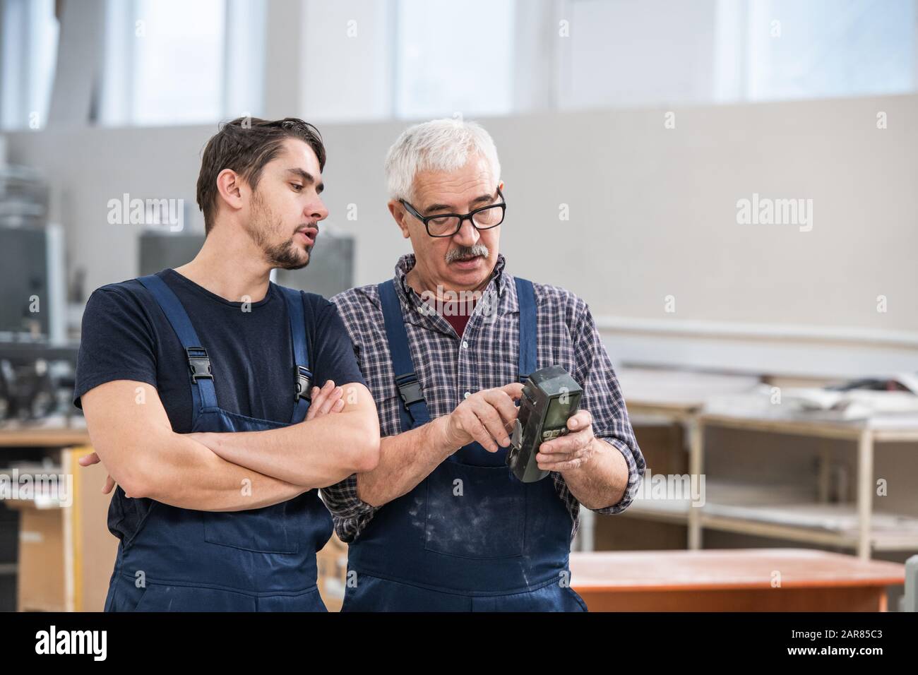 Explaining how to use remote controller Stock Photo - Alamy