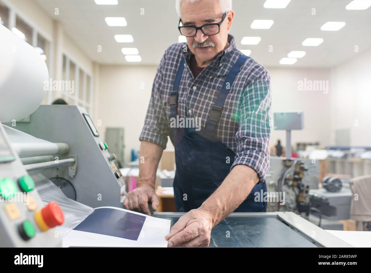 Portrait factory worker examining hi-res stock photography and images ...