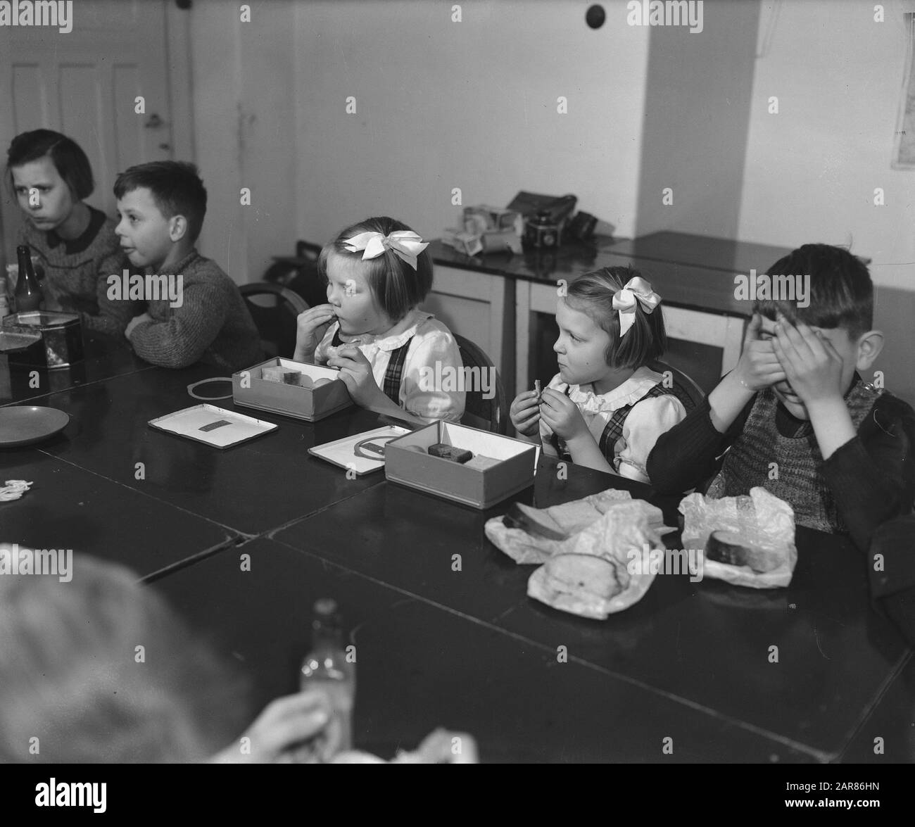 Princess Beatrix and princess Irene eat bread meal at Children's community The Workshop of Kees ...