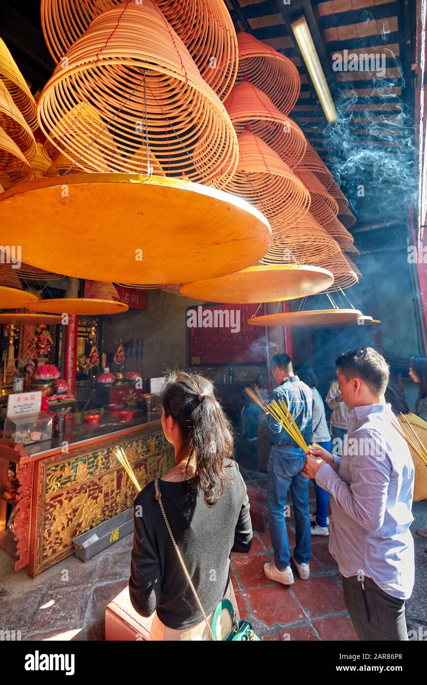 People praying in the Buddhist Pavilion Zhengjiao Chanlin at the A-Ma ...
