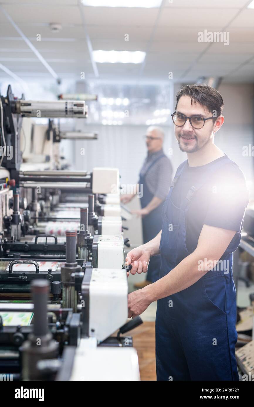 Working at production line of printing plant Stock Photo - Alamy