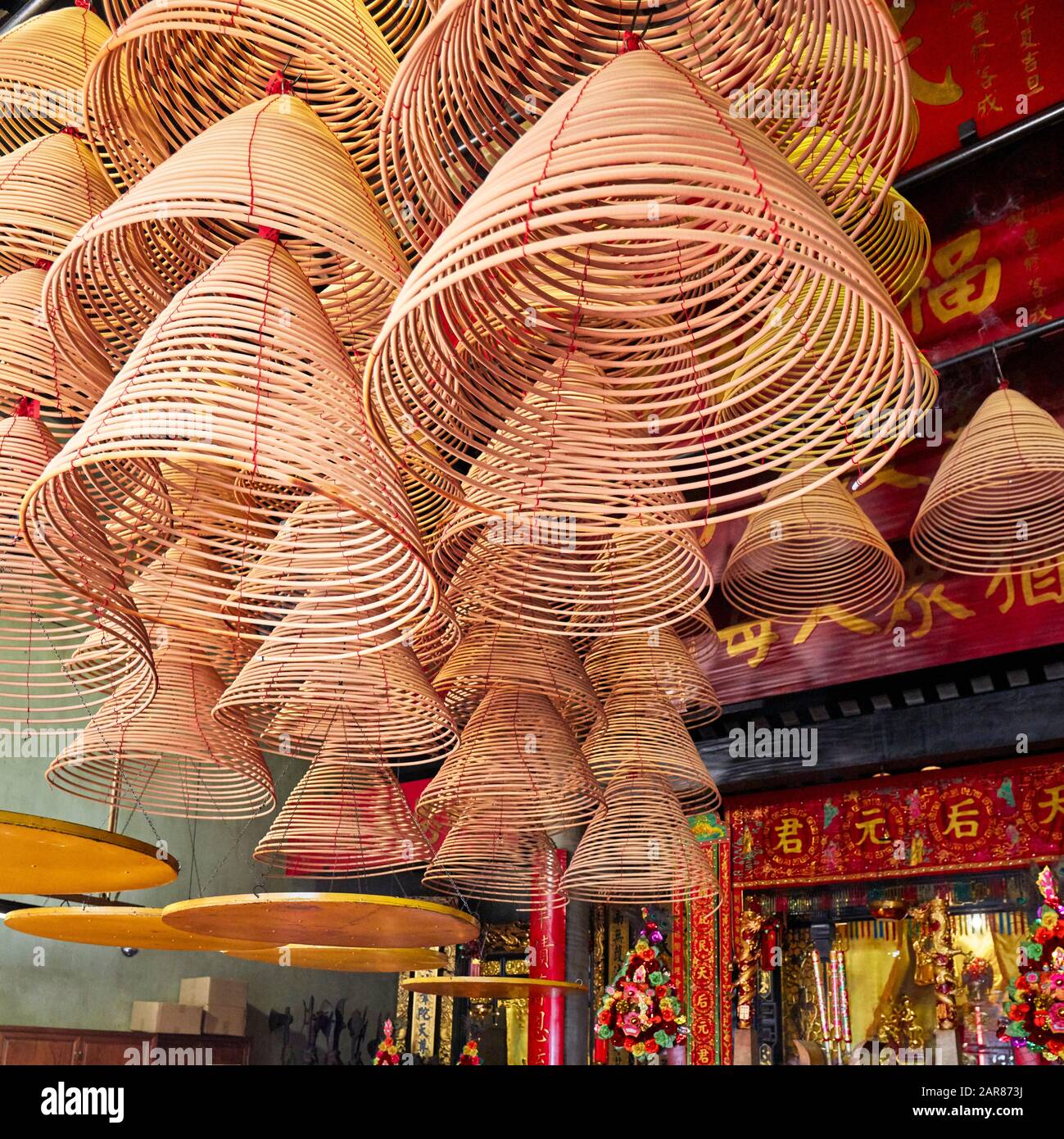 Large incense spirals hanging from the ceiling in the Buddhist Pavilion ...