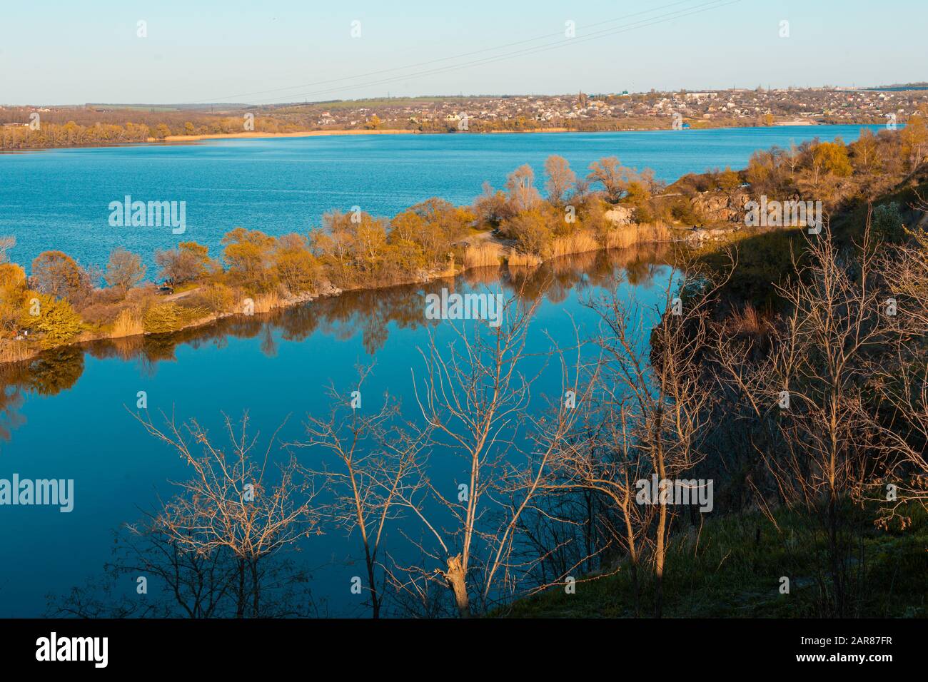 Top view of a lake divided by a road at sunset. Picturesque places ...