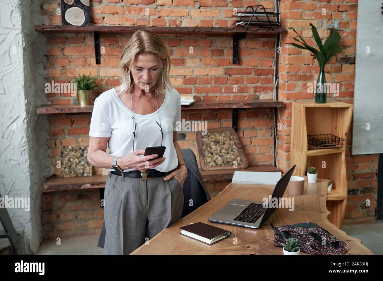 Checking phone message Stock Photo - Alamy