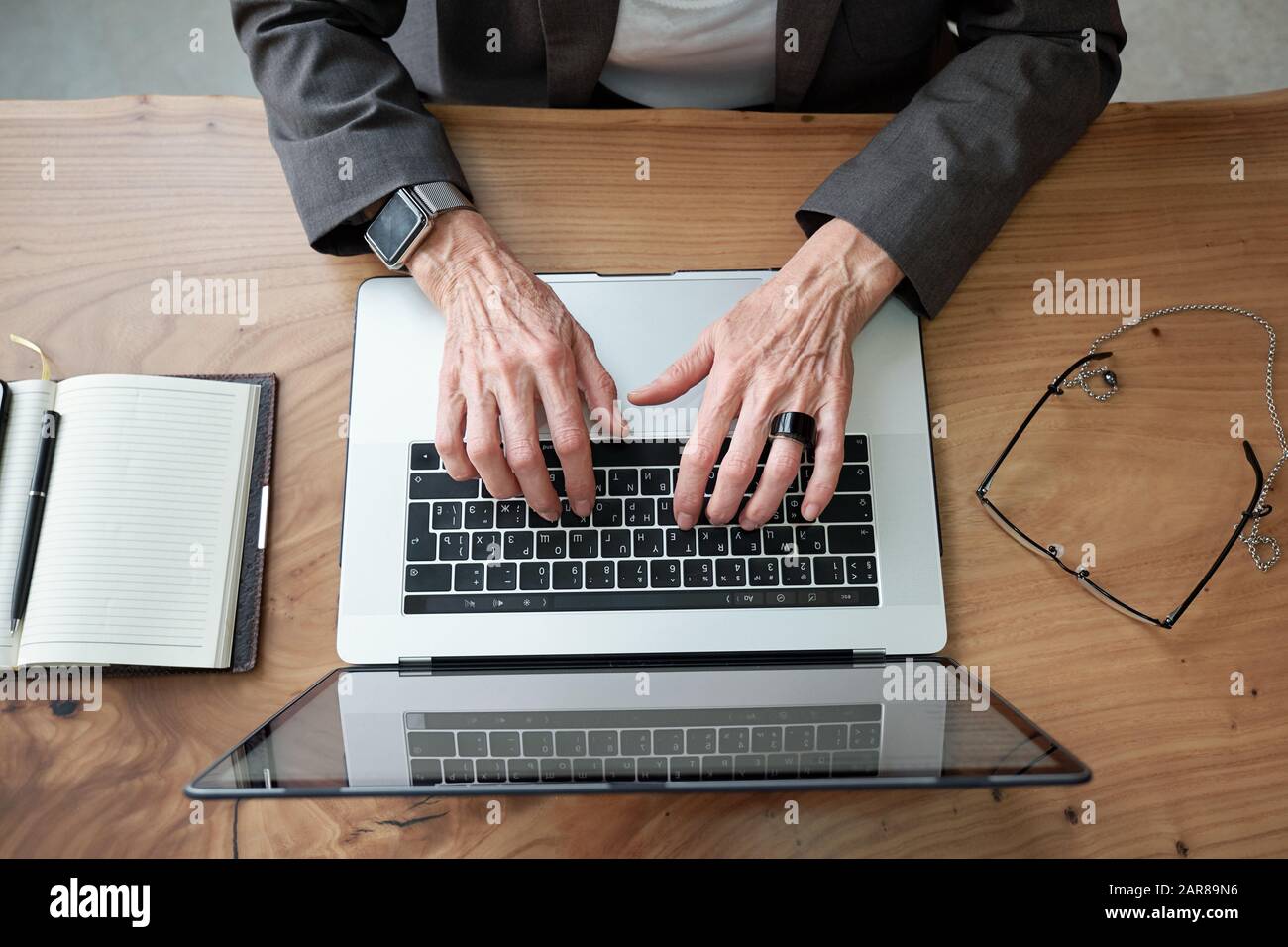 Typing on laptop keyboard Stock Photo - Alamy