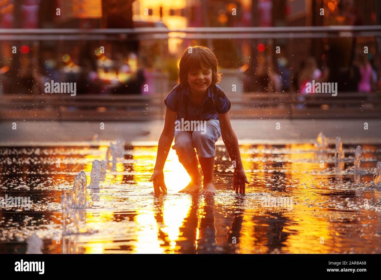 Child touching water hi-res stock photography and images - Alamy