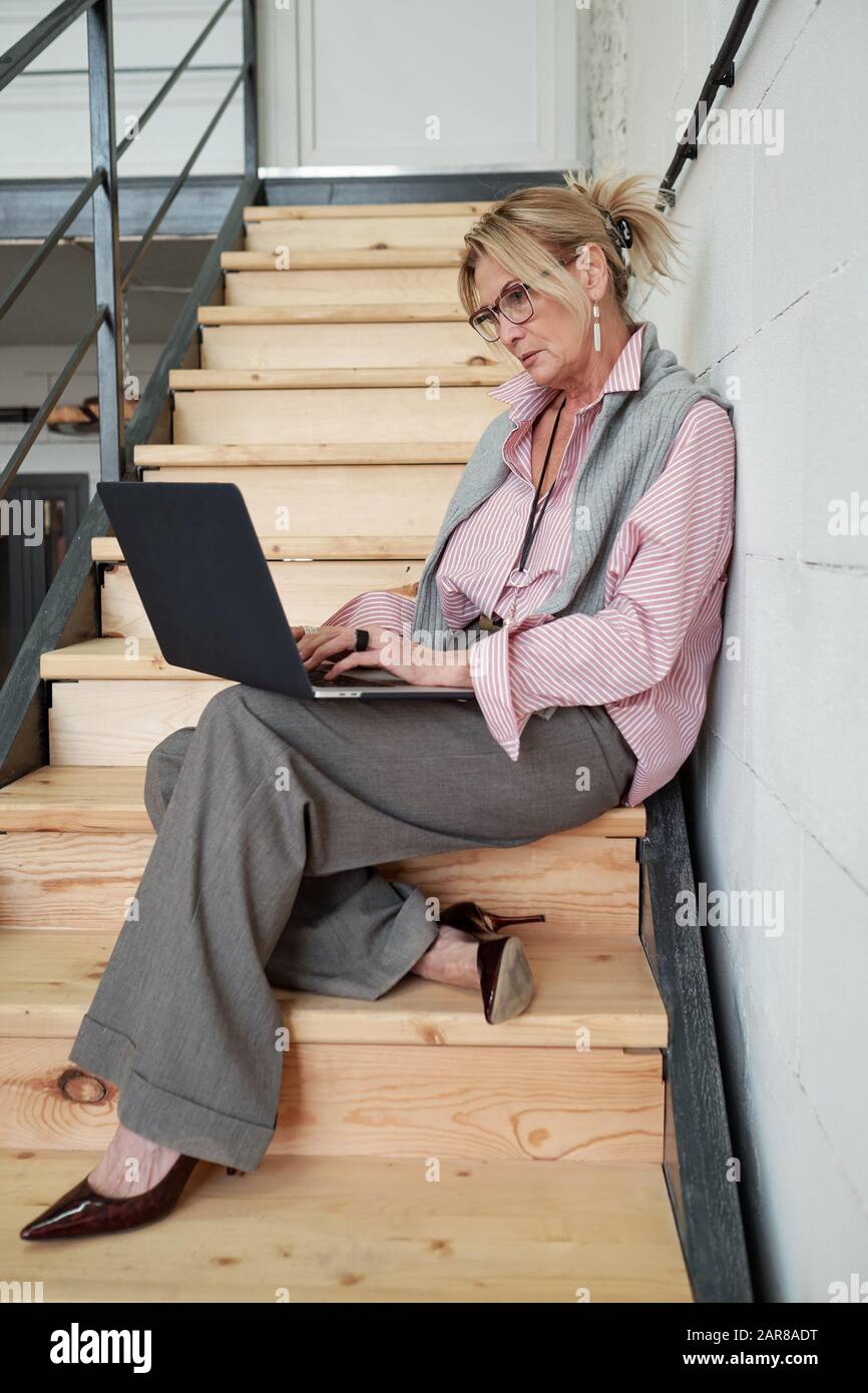 Mature woman analyzing data hi-res stock photography and images - Alamy