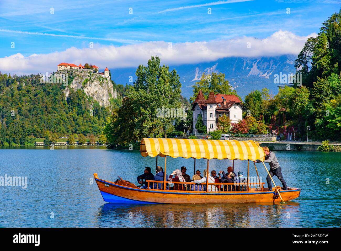 Tourists taking boat on Lake Bled, a popular tourist destination in ...