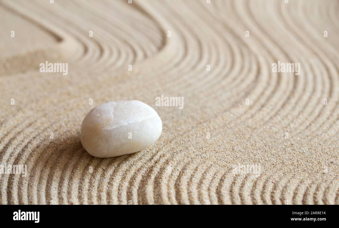 White stone in a zen garden Stock Photo - Alamy