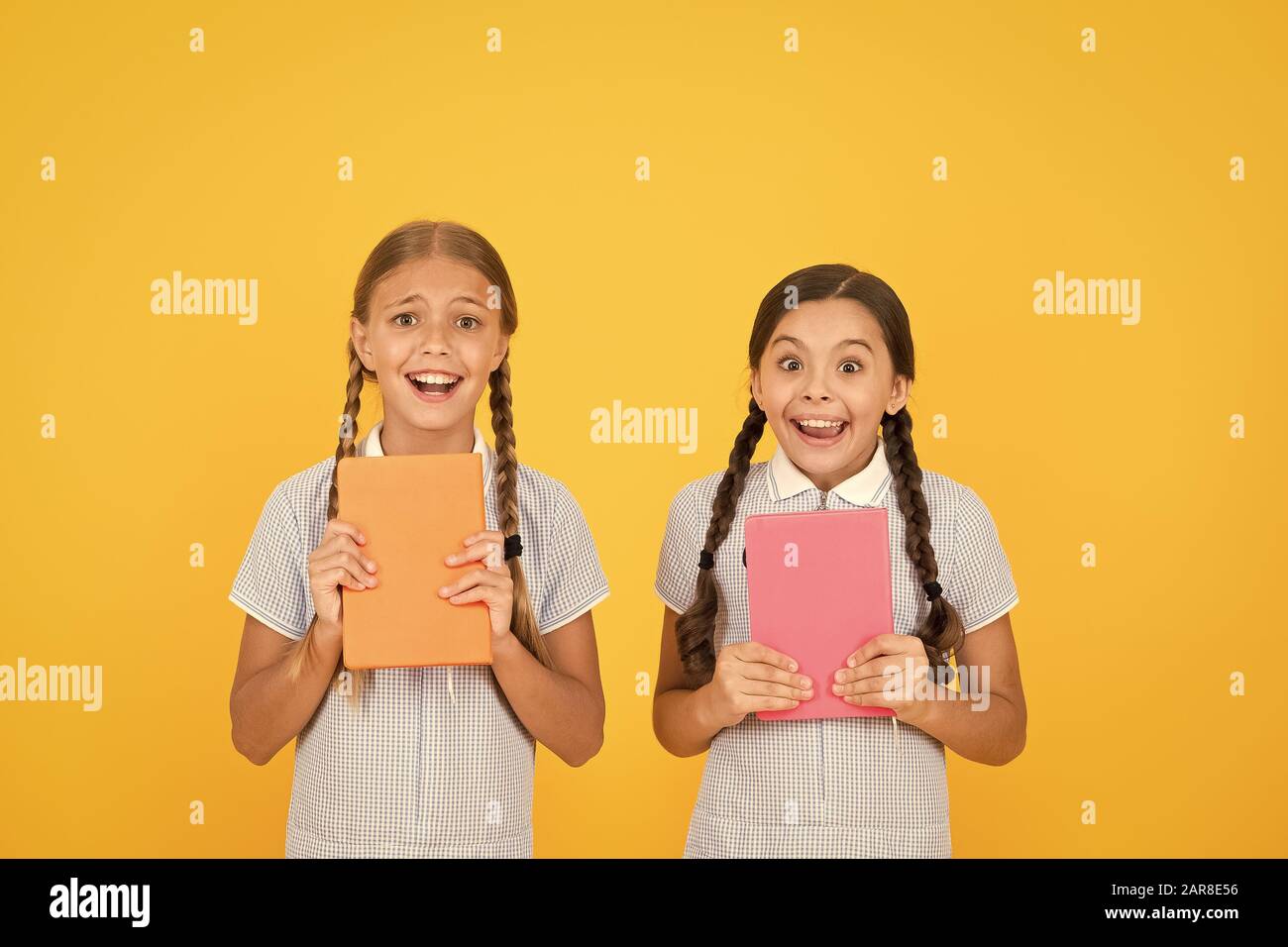 Hysterical laugh. Do not panic. Cute children reading book on yellow ...