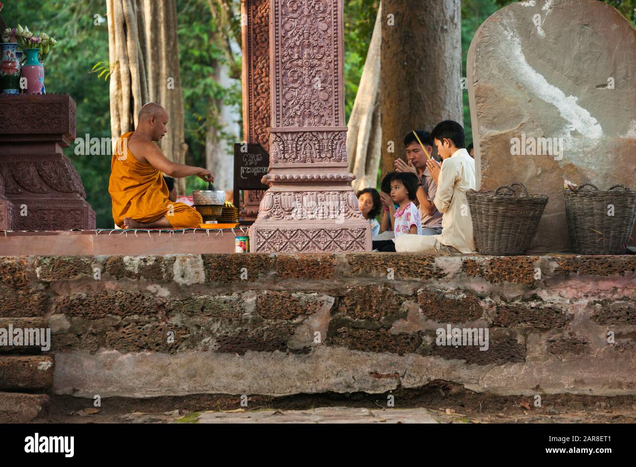 Cambodian family are praying at a temple in Siem Reap, Cambodia Stock ...
