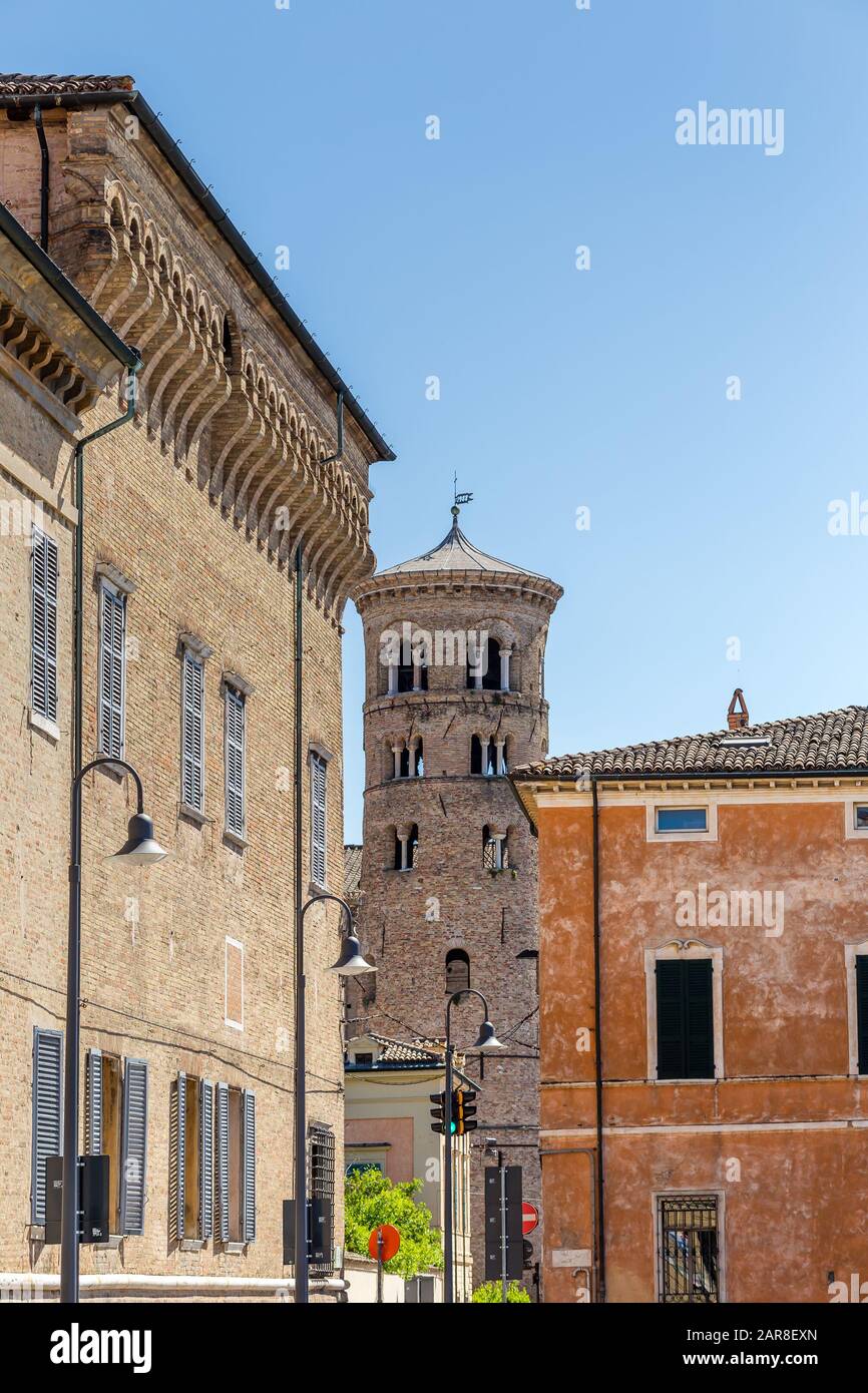 medieval belfry between ancient buildings in historical center Stock ...