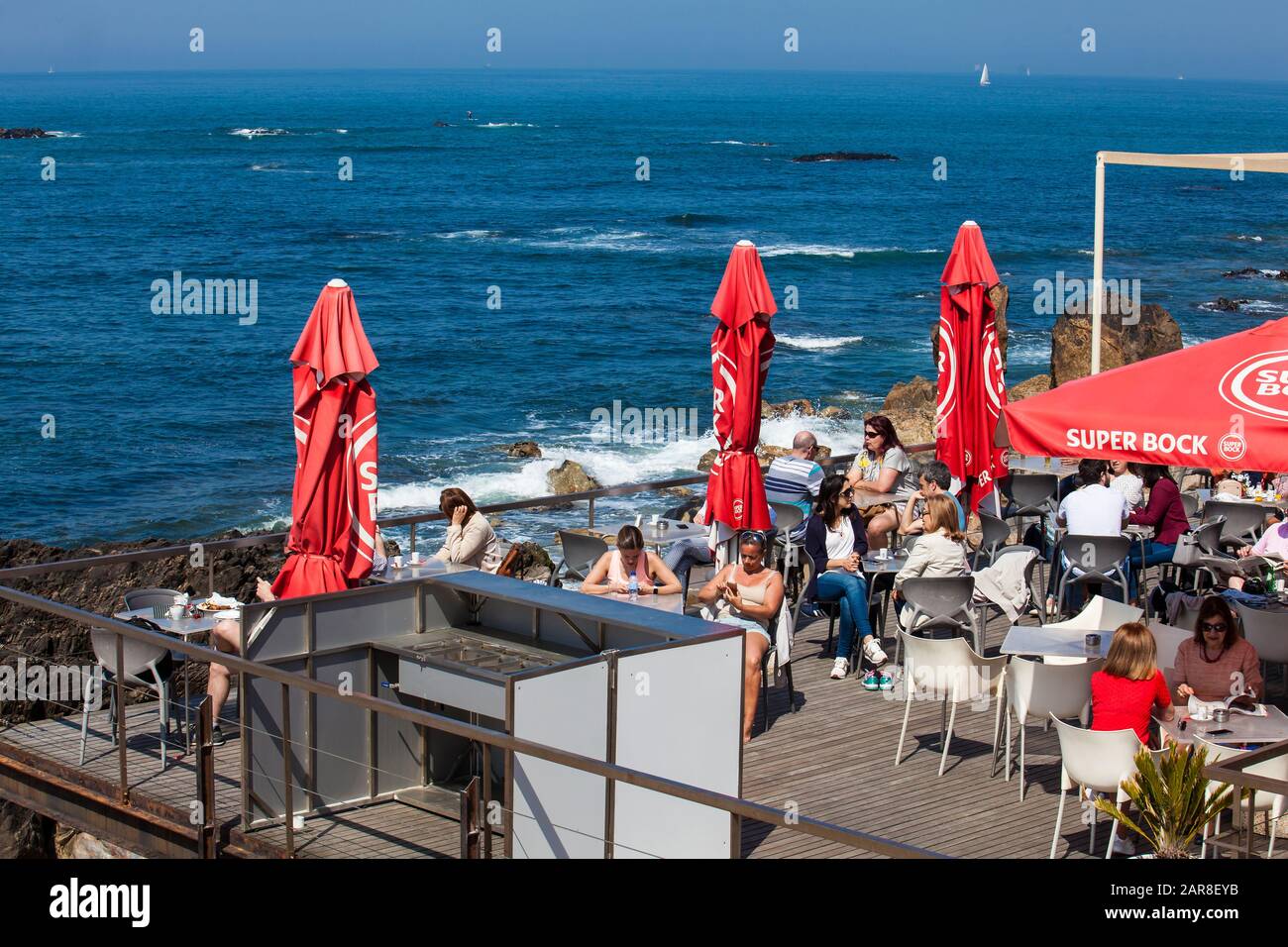 PORTO, PORTUGAL - MAY, 2018: Tourists and locals enjoying an early ...