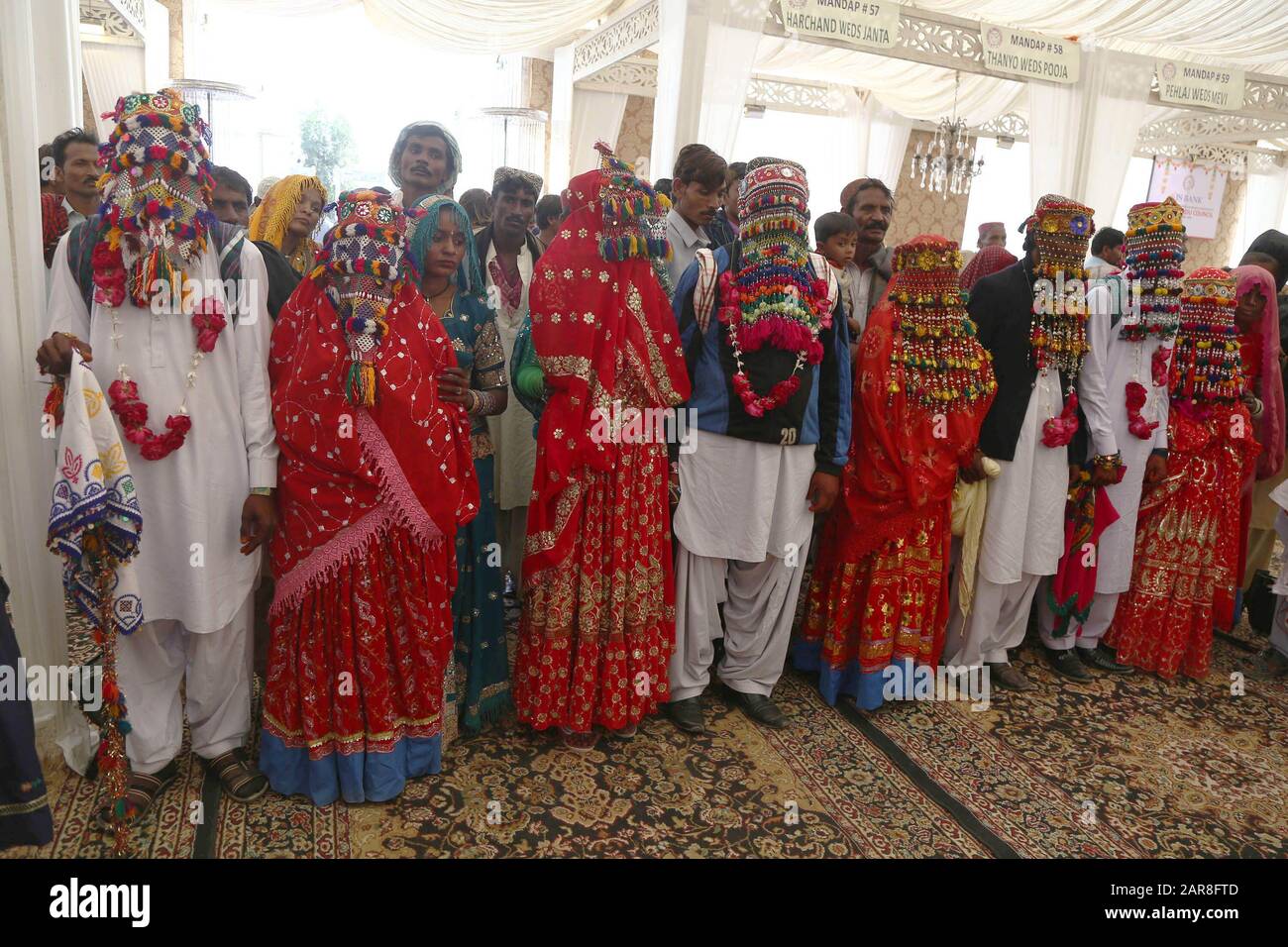 Karachi. 26th Jan, 2020. Brides and grooms attend a mass wedding ...