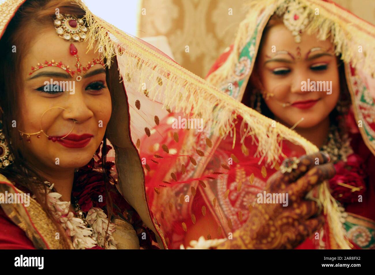 Karachi. 26th Jan, 2020. Two brides attend a mass wedding ceremony in ...
