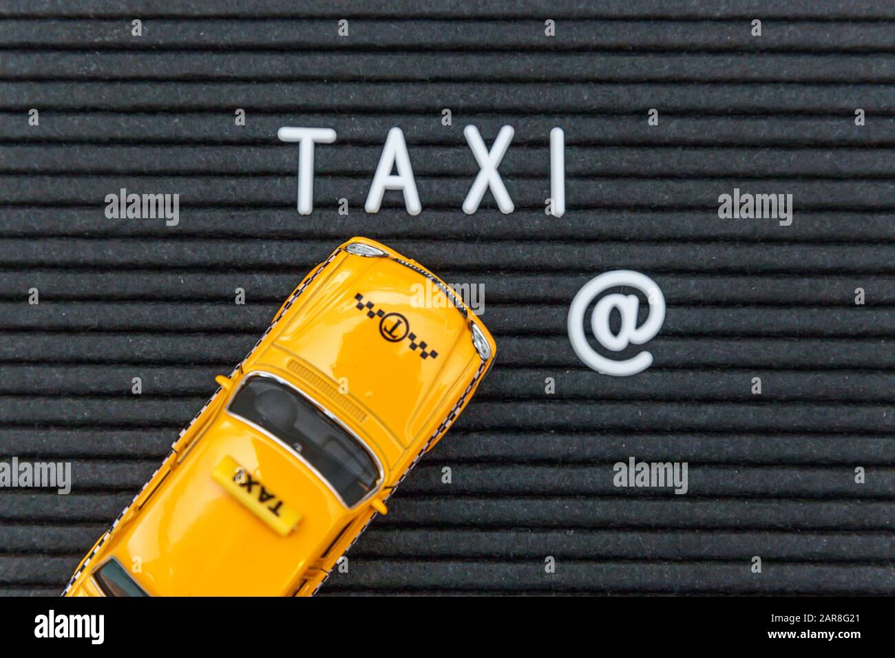 Simply design yellow toy car Taxi Cab model with inscription TAXI ...
