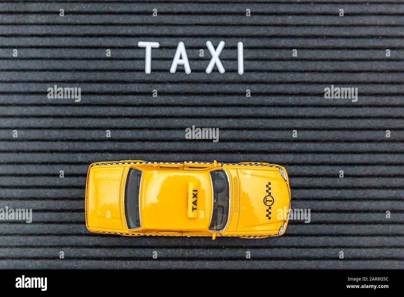 Simply design yellow toy car Taxi Cab model with inscription TAXI ...