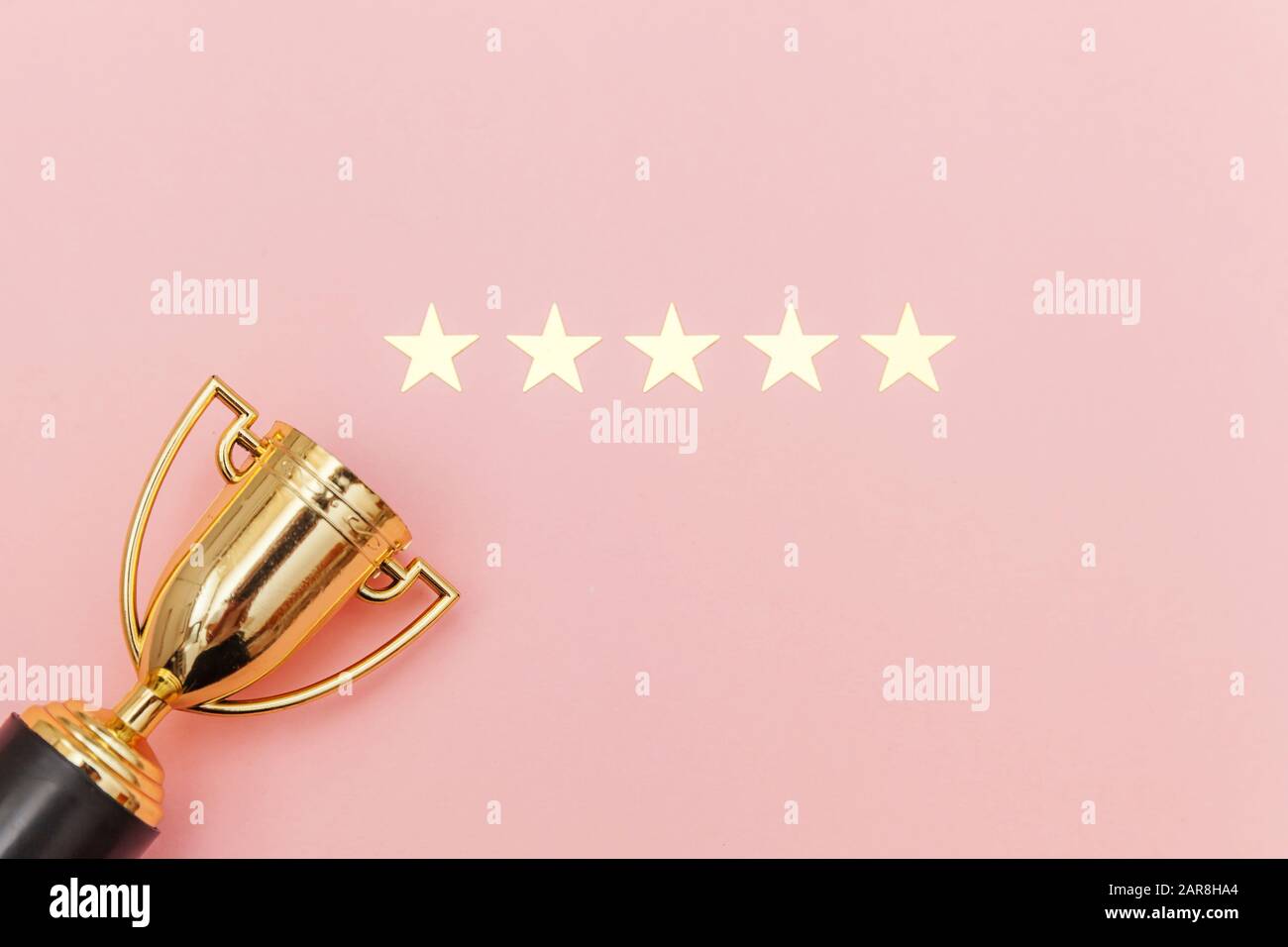 Simply flat lay design winner or champion gold trophy cup and 5 stars ...