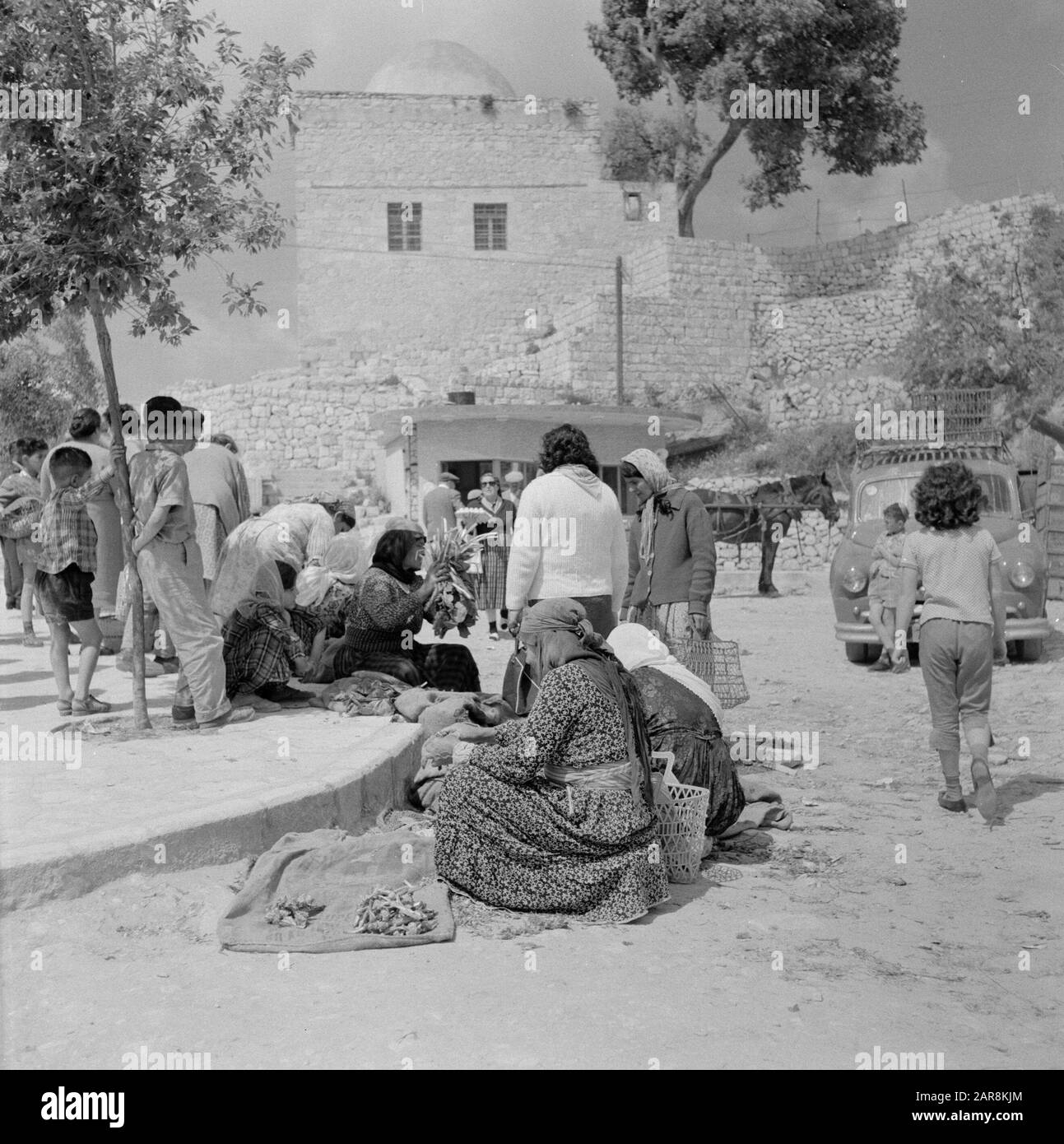 Street trade on the market of Safad (Safed). Women bring vegetables to ...