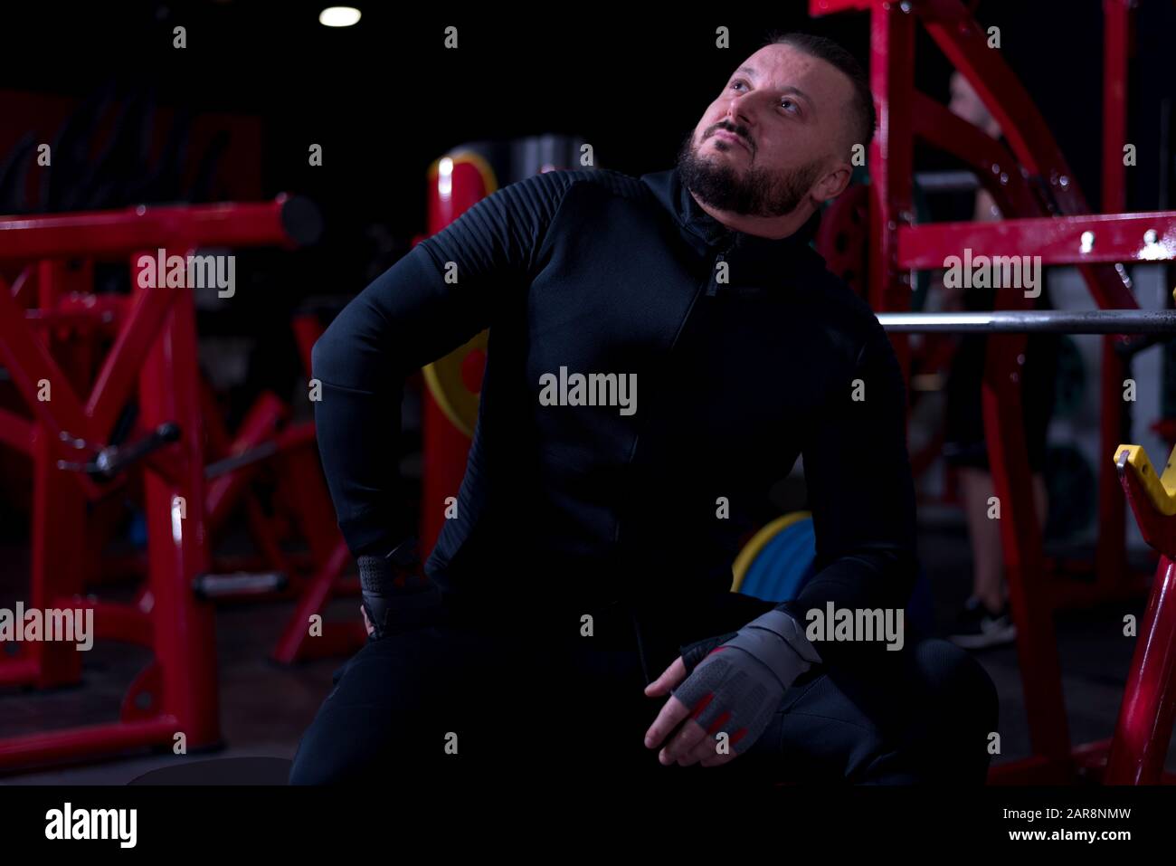 Bodybuilder resting after workout. Muscular Man Resting After Exercise ...