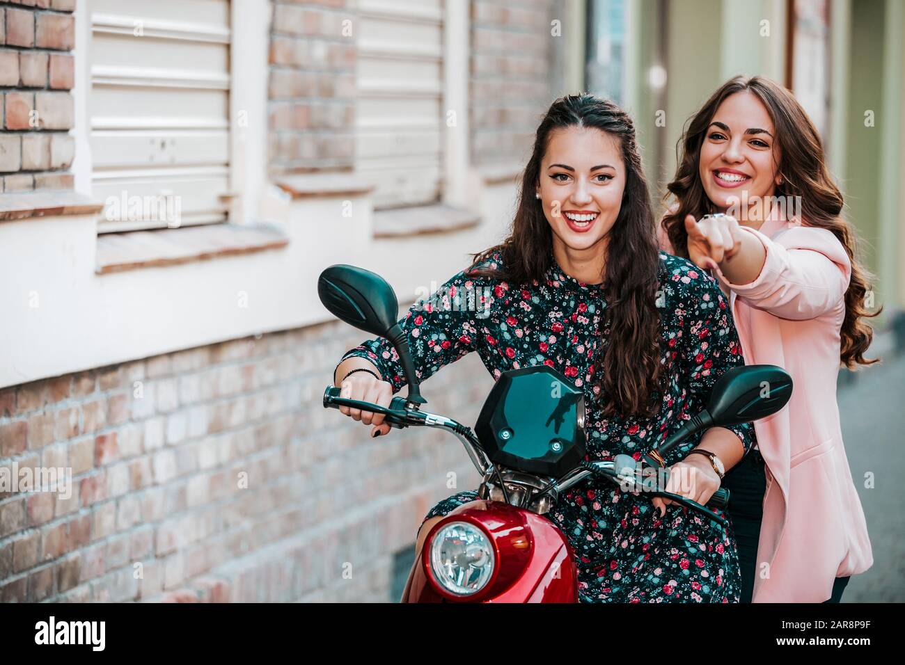 Young woman riding motorcycle through hi-res stock photography and ...